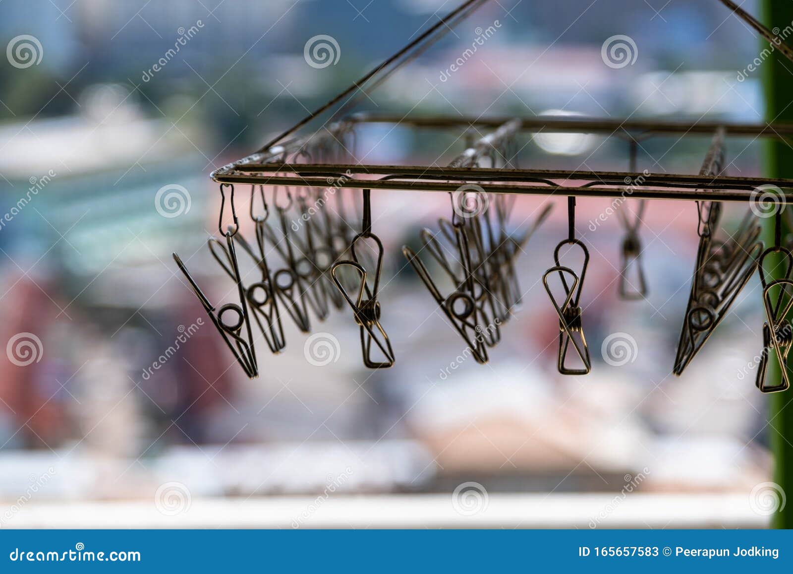 Metal Clothespins Hanging with Wire on Blur Background Stock Image ...