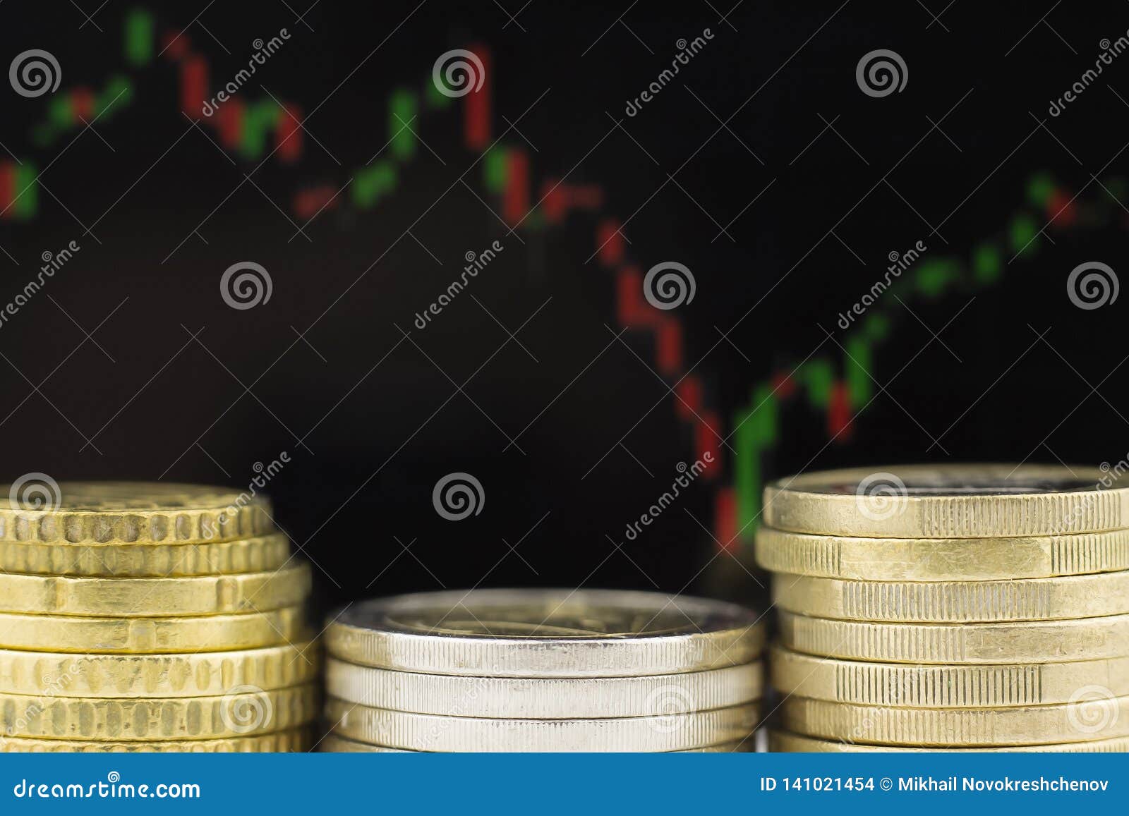 Metal Coins Against the Background of the Financial Schedule Stock ...