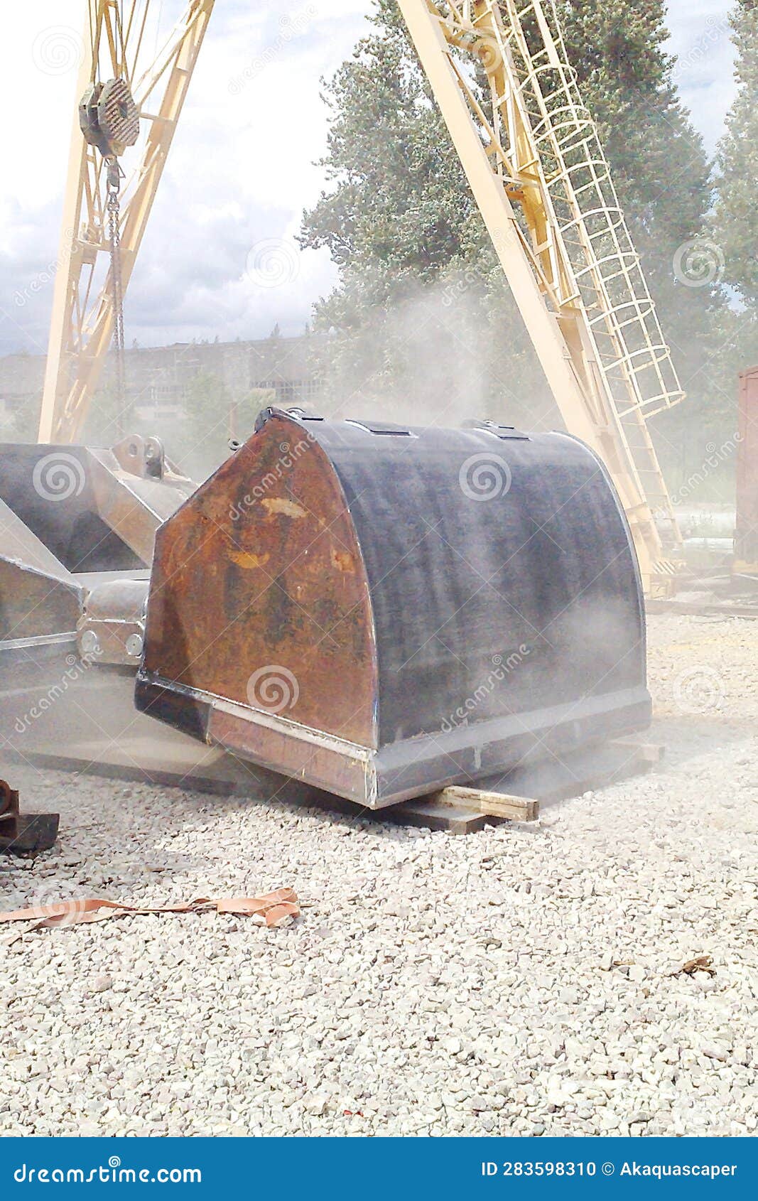 A Construction Sandblasting Machine Stands On A Work Platform For ...