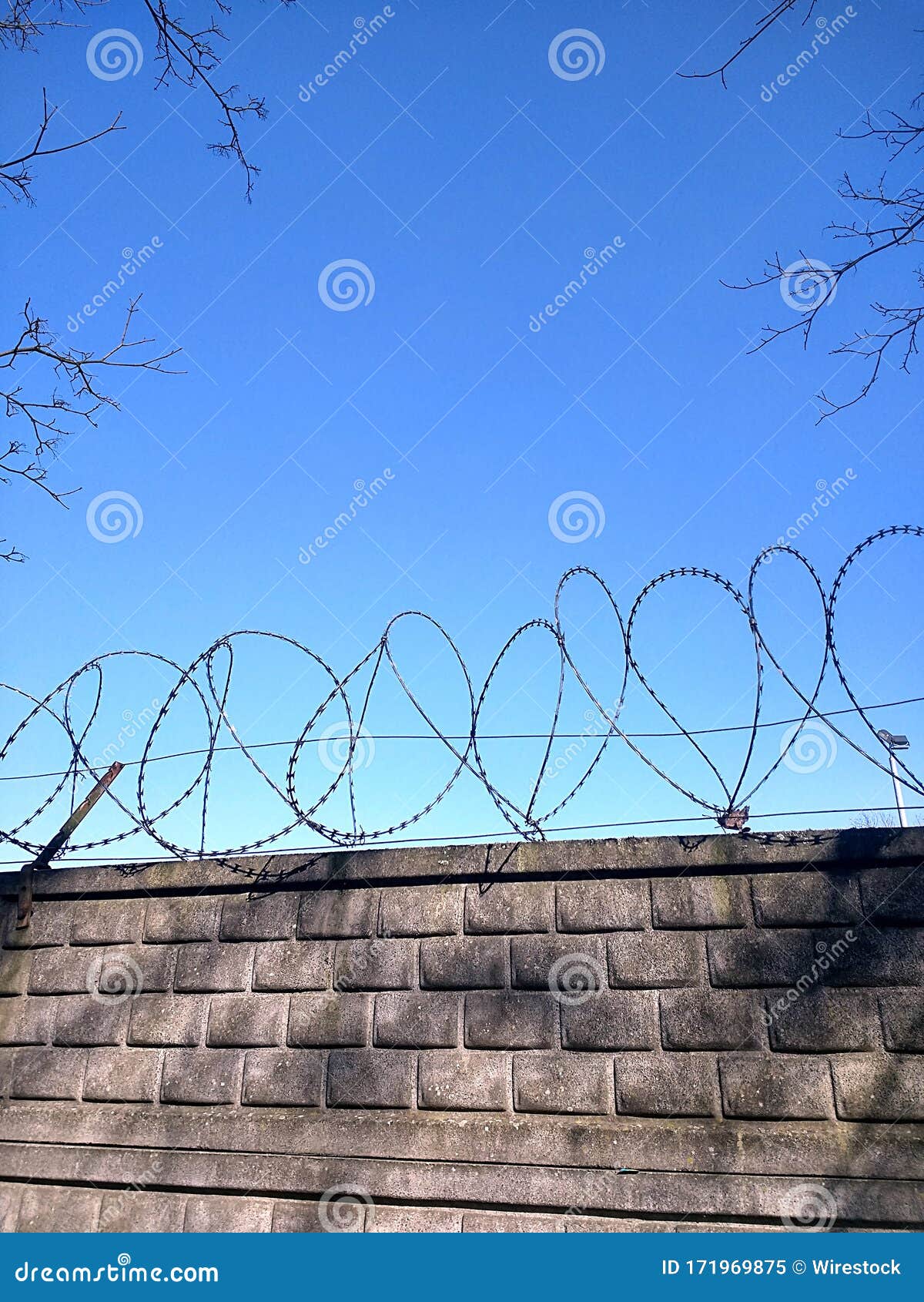 Metal Cord with Sharp Edges on a Wall Made of Rectangular Stones Under ...