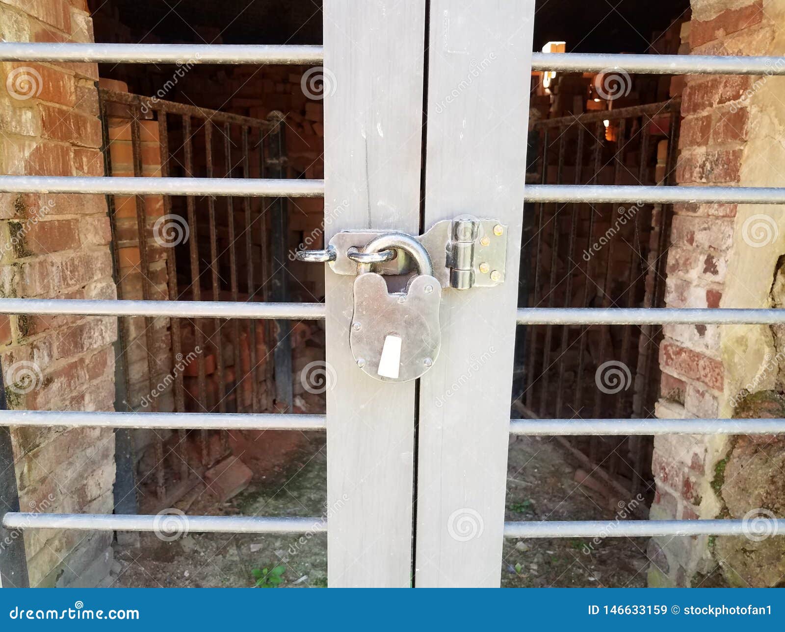 Metal Door with Lock and Red Bricks or Masonry Stock Image - Image of ...