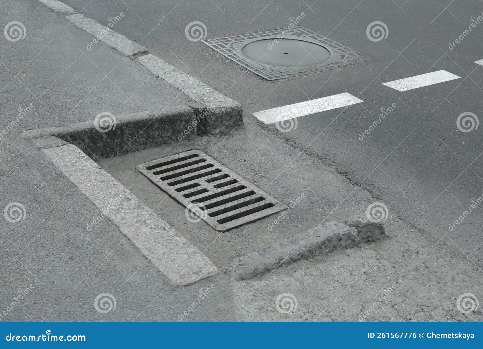 Metal Drain Grate and Sewer Hatch on Asphalt Outdoors Stock Photo ...