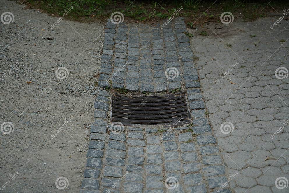 Metal Drainage on Cobblestone Path Stock Image - Image of granite ...