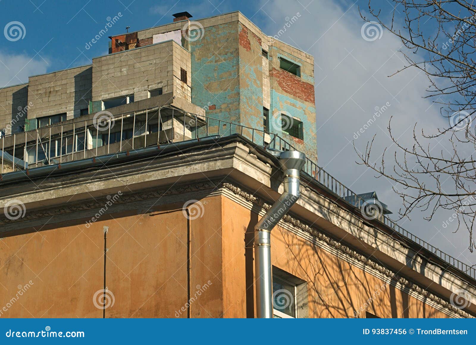 A Metal Drainpipe on the Background of an Old Shattered Wall. Stock ...