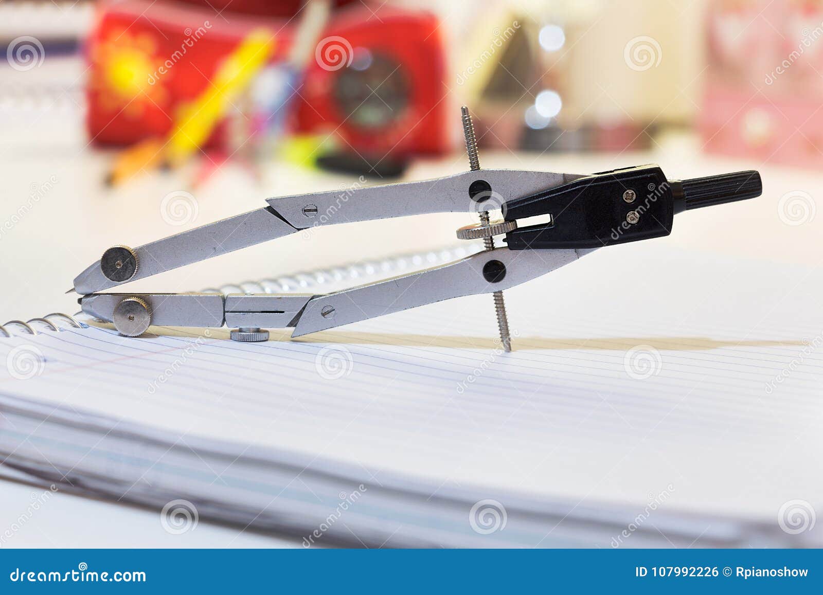 A Metal Drawing - Drafting Compass on a Notebook. Stock Photo - Image ...