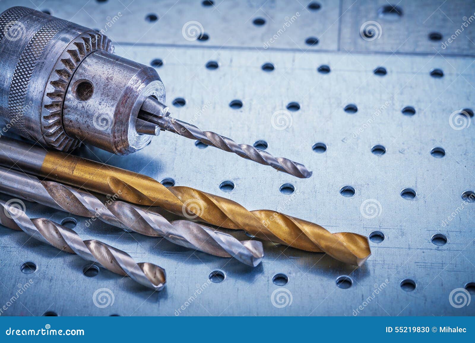 Metal Drill with Boring Bits on Perforated Stock Photo - Image of metal ...
