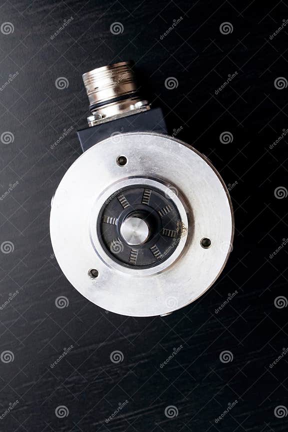 Metal Encoder on a Black Wooden Table Stock Image - Image of inverter ...