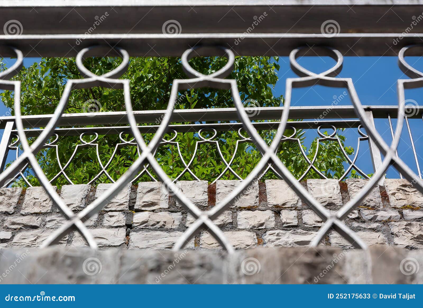 Metal Fence in Form of Human Silhouettes Stock Image - Image of green ...