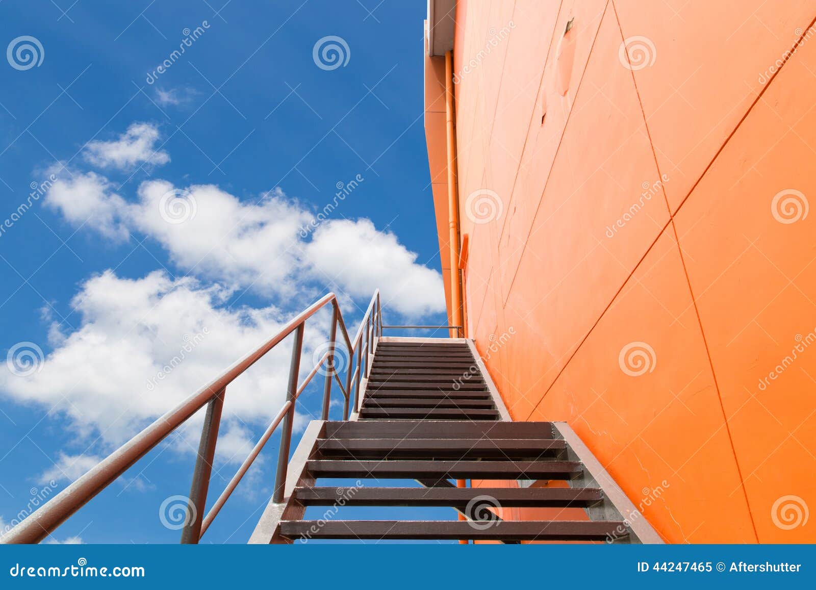 Metal Fire Escape or Emergency Exit on Orange Wall of Buliding Stock ...