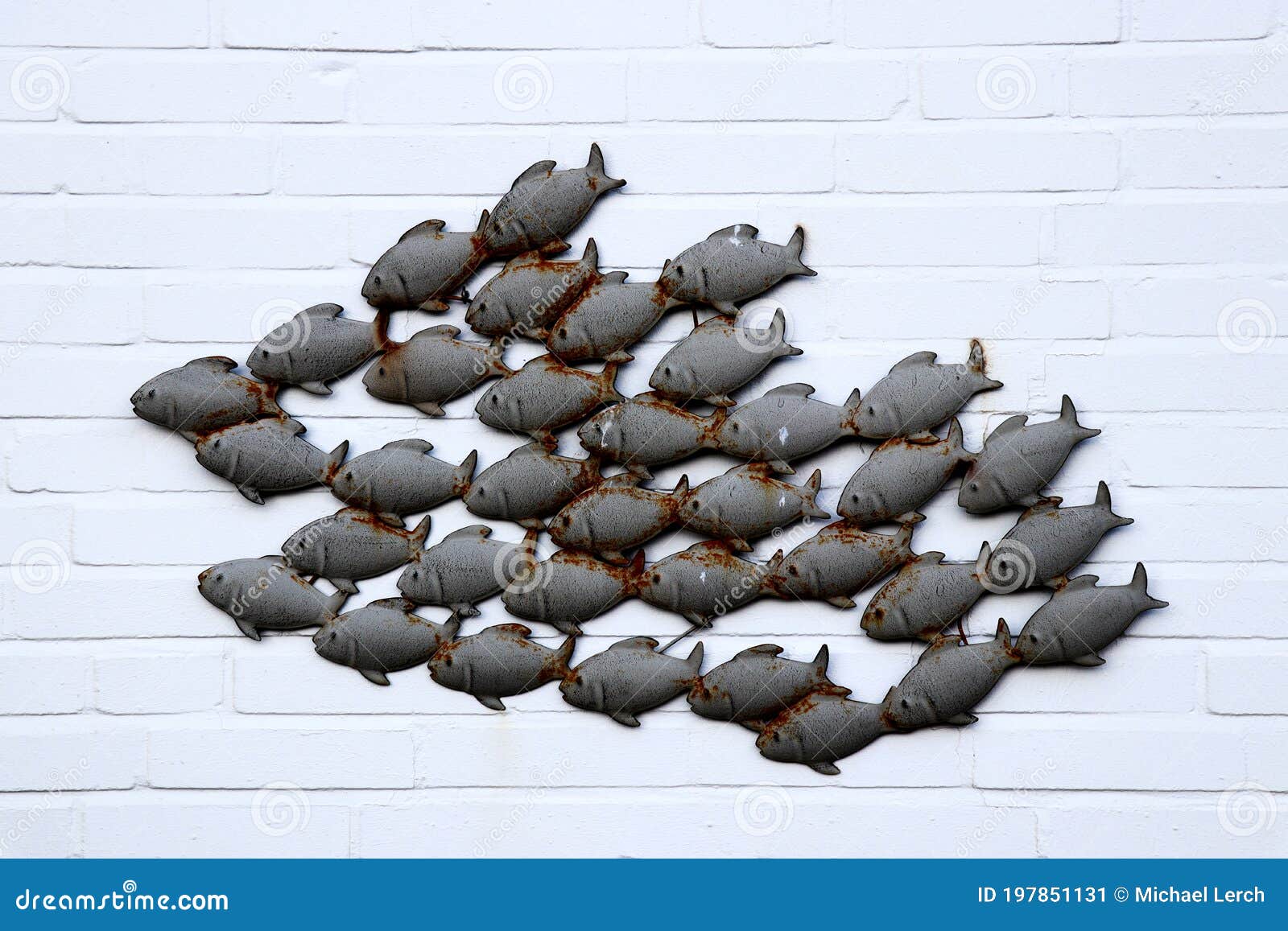 Metal Fish Decoration on a White Brick Wall Stock Image - Image of ...