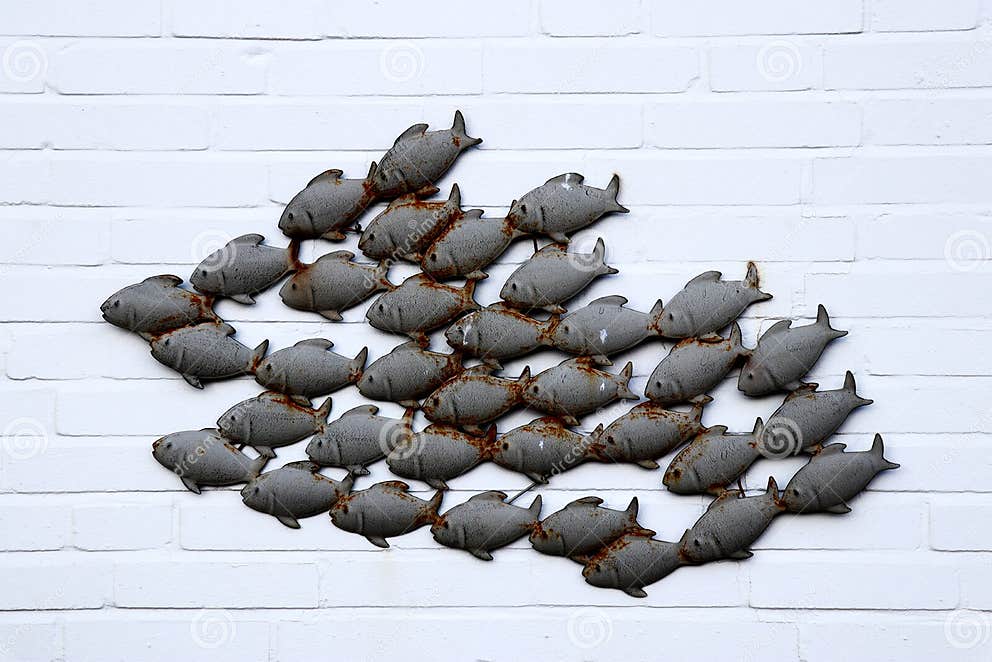 Metal Fish Decoration on a White Brick Wall Stock Image - Image of ...