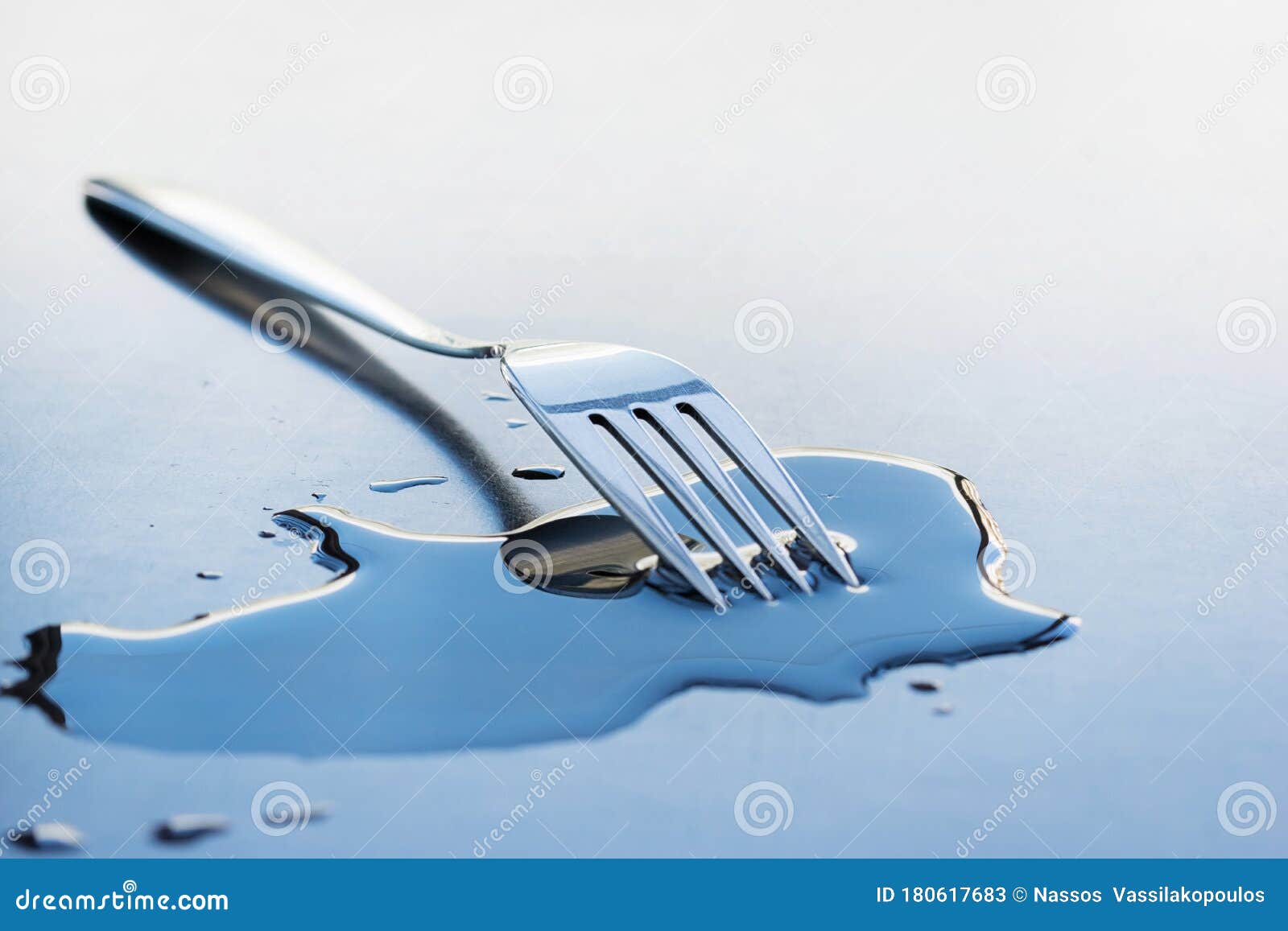 Metal Fork on a Large Water Drop on a Clean Surface Stock Image - Image ...