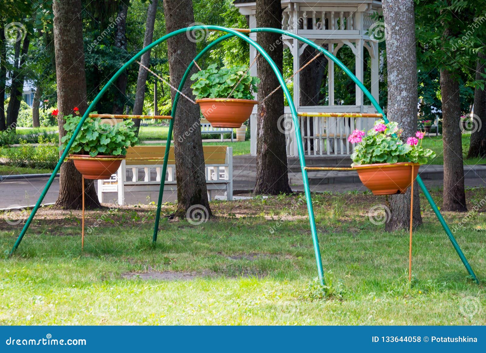 Metal Frame for Hanging Pots with Flowers in the Park Stock Photo ...