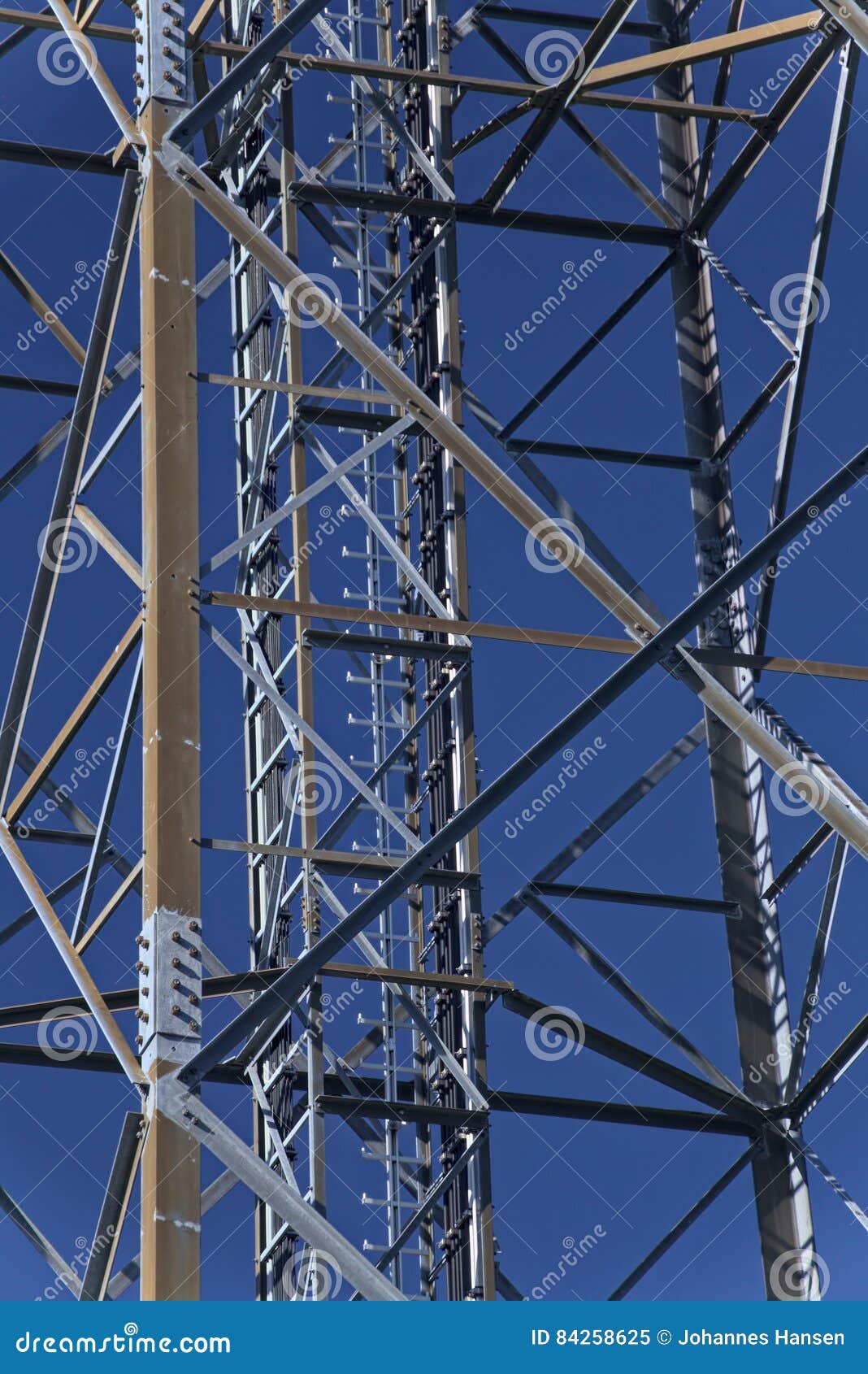 Metal Frame of Telecommunications Tower in Front of a Dark Blue Sky ...