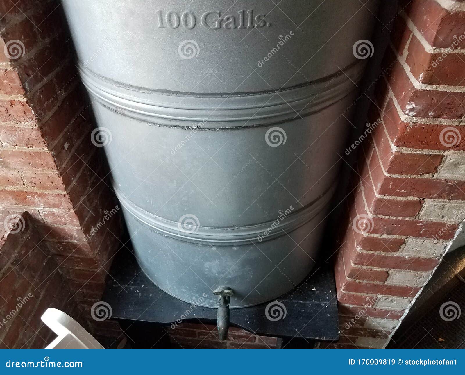Metal 100 Gallon Container or Barrel and Bricks Stock Image - Image of ...