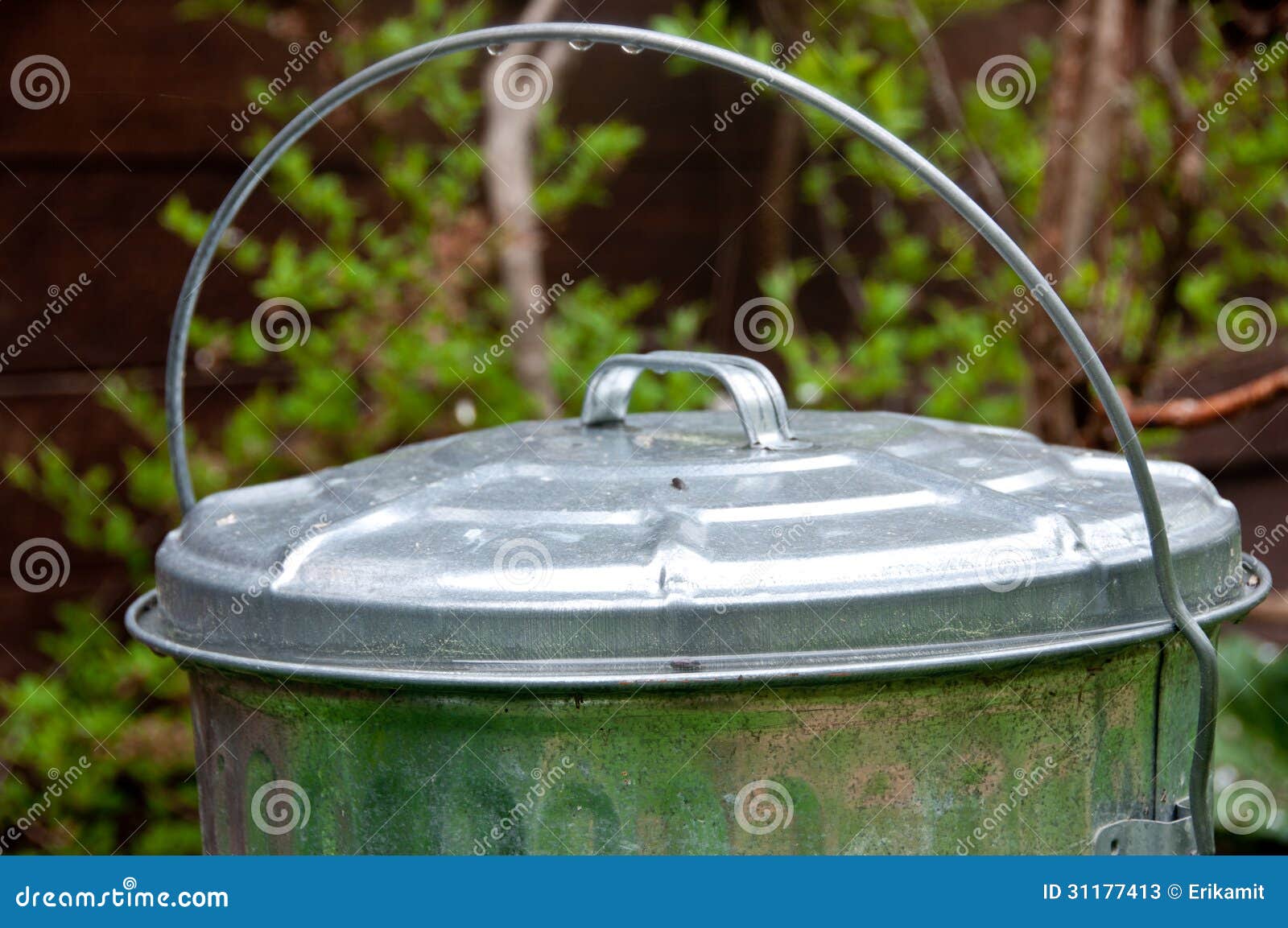 Metal Garbage Can in the Rain Stock Image - Image of zinc, metal: 31177413
