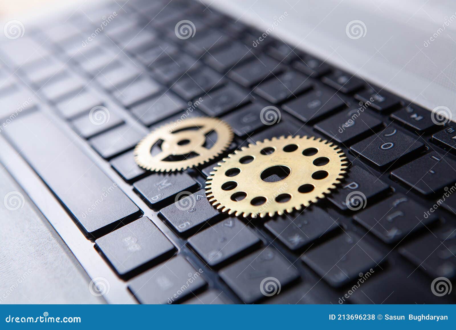 Metal Gear Wheels on a Computer Keyboard Stock Photo - Image of ...
