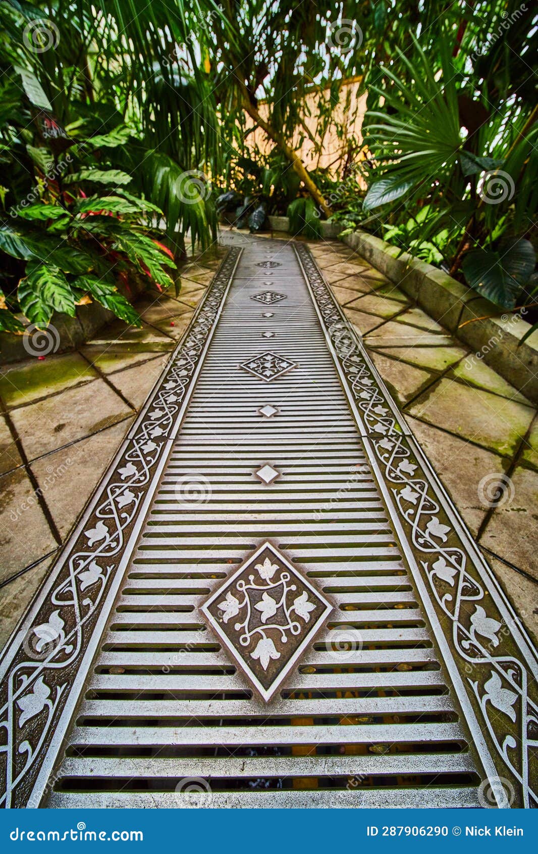 Metal Grates and Fancy Decor on Sidewalk Path through Conservatory of ...