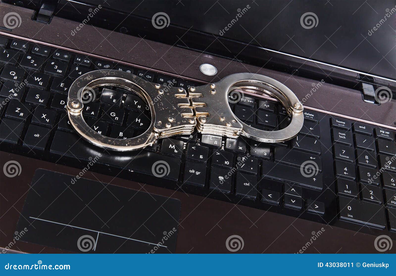 Metal Handcuffs on Laptop Keyboard Stock Image - Image of keyboard ...