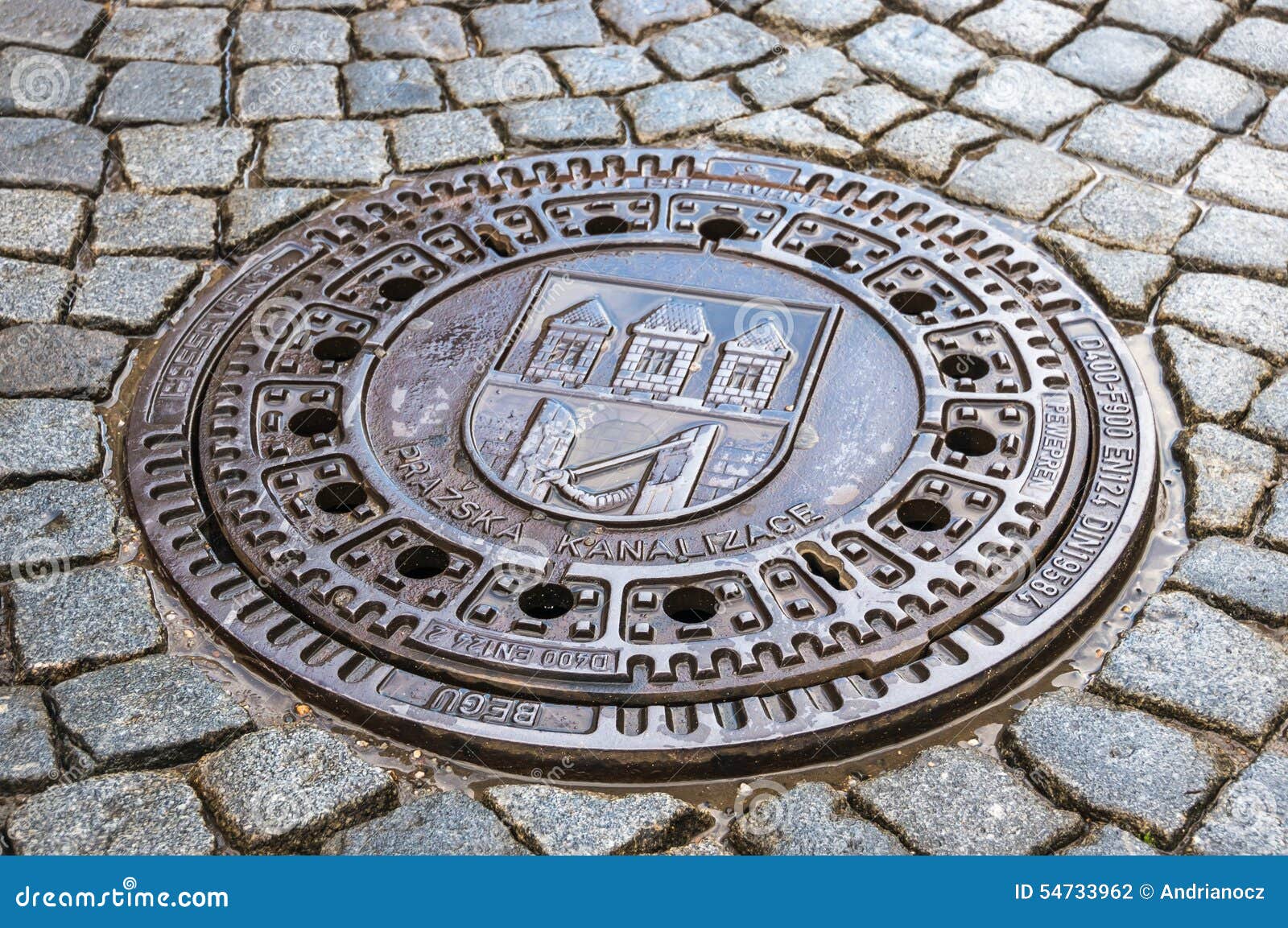 Metal Hatch Sewer Manhole and Cobblestone Pavement Editorial ...
