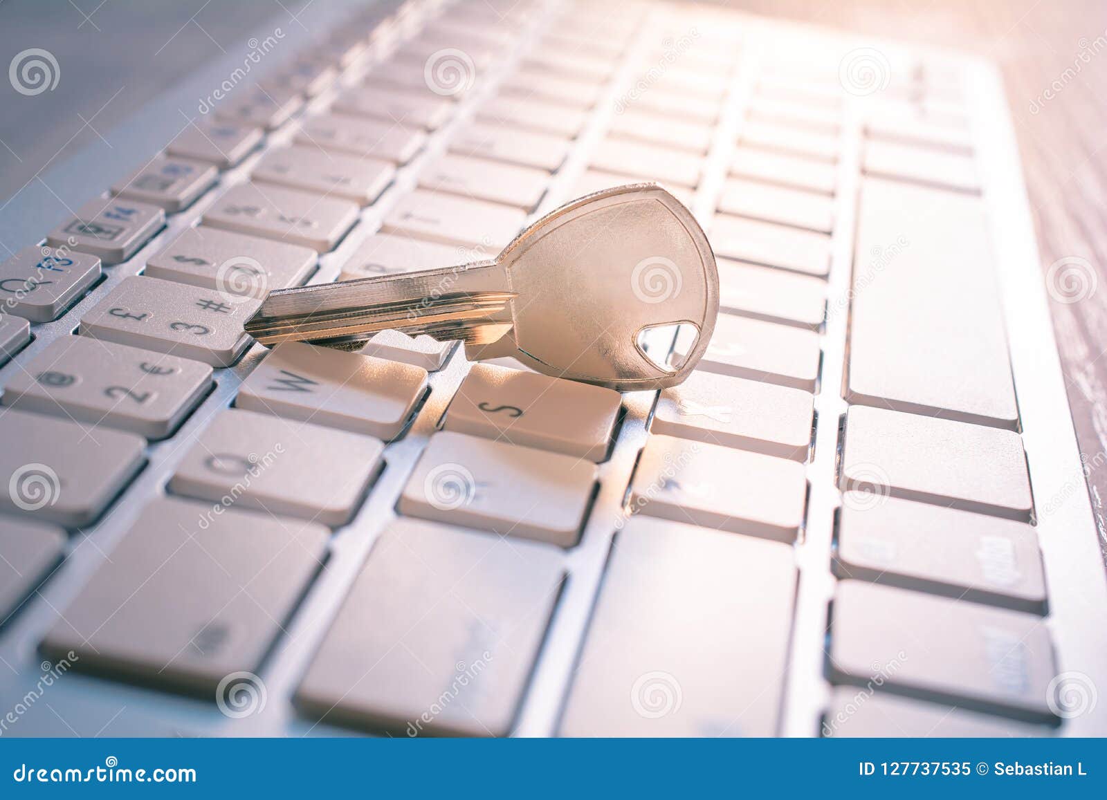 Metal Key on a White Keyboard - Secure Computer Login Concept Stock ...