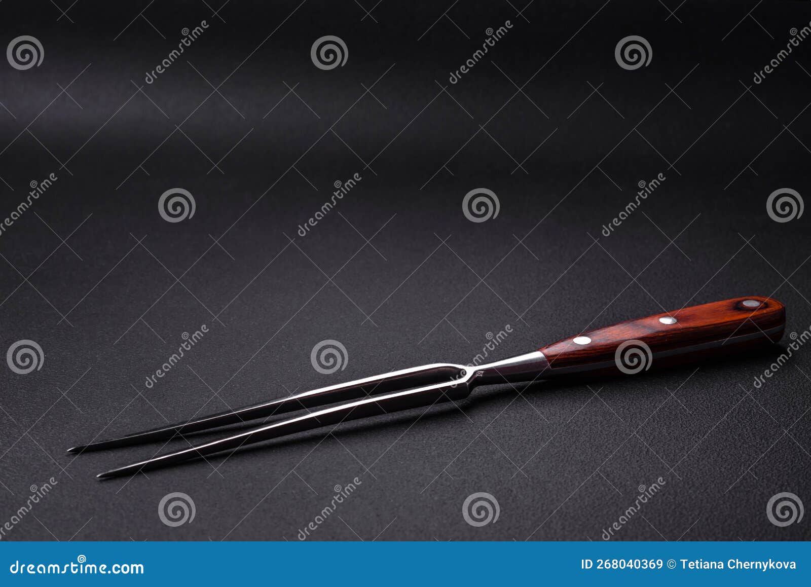 Metal Kitchen Fork on a Dark Textured Concrete Background Stock Image ...