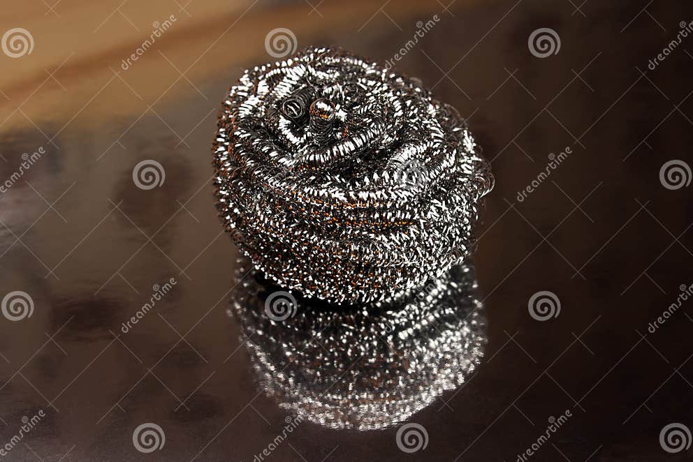 Metal Kitchen Scraper on a Mirrored Kitchen Surface Stock Photo - Image ...