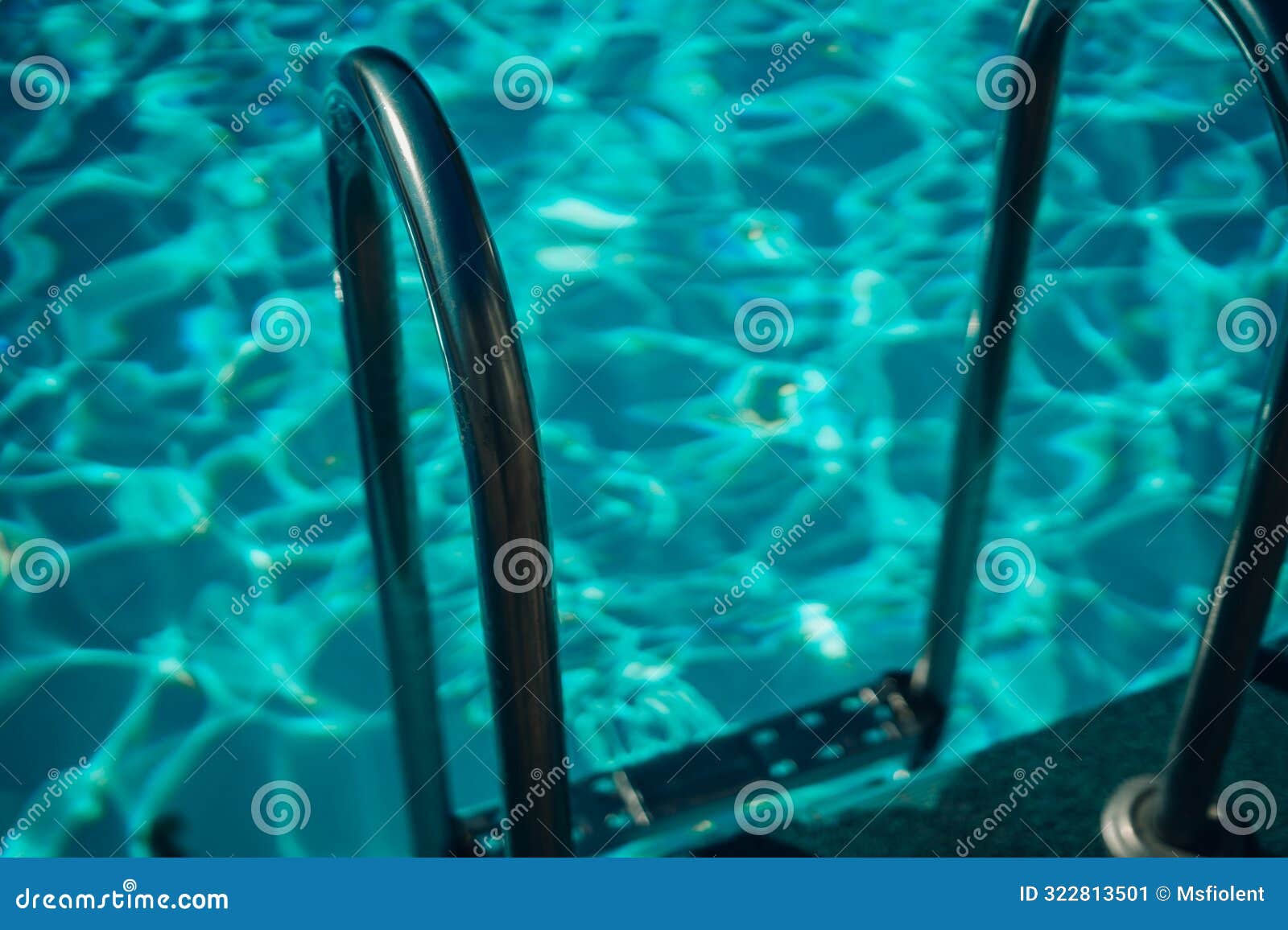 A Metal Ladder is in the Water. the Water is Clear and Calm. the Ladder ...