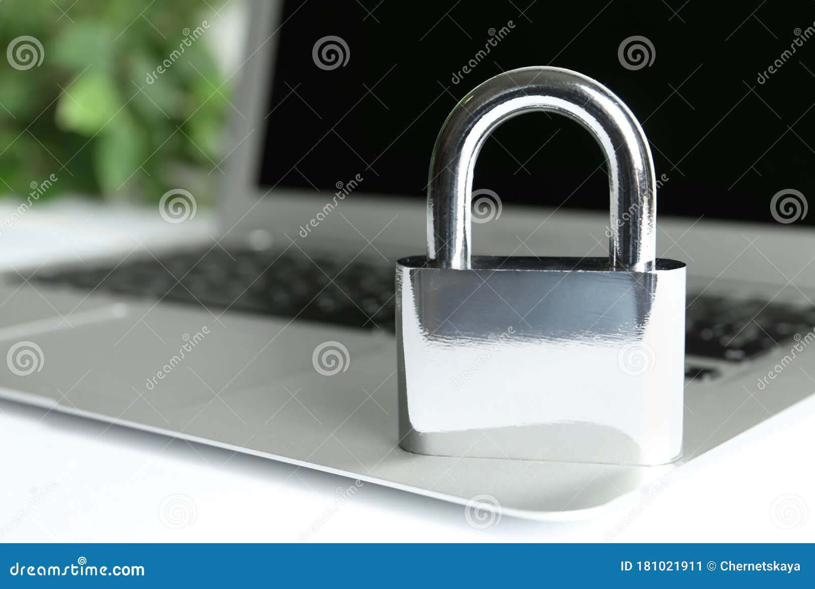 Metal Lock and Laptop on Table. Protection from Cyber Attack Stock ...