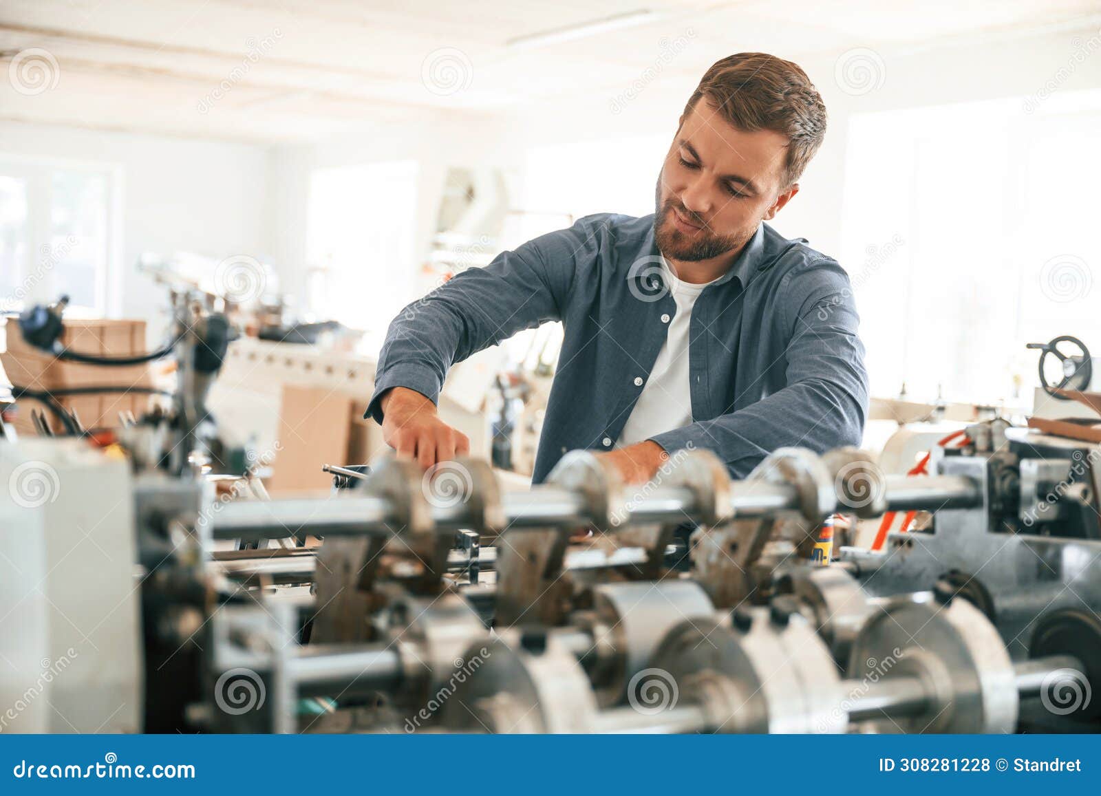 Metal Made Machine. Handsome Man is Working at the Factory of Creating ...