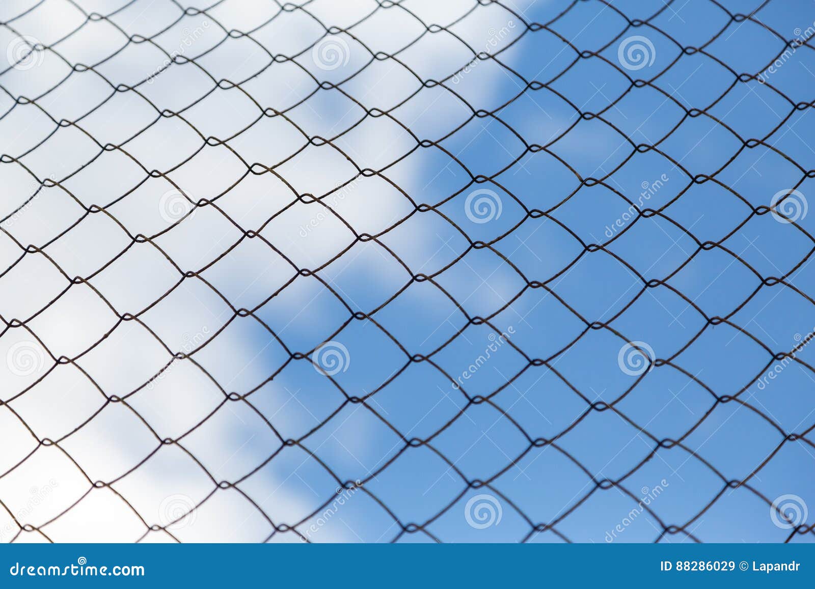 Metal Mesh Netting on the Blue Sky Background and Clouds Stock Image ...