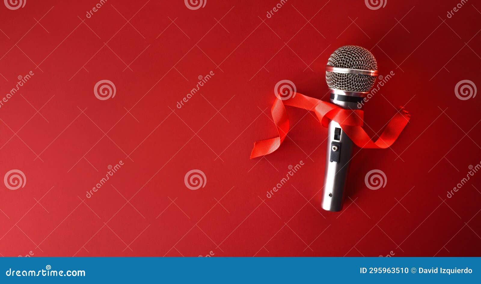 Metal Microphone with Red Bow on Red Background Top View Stock Photo ...