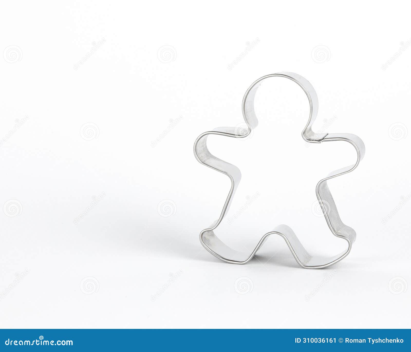 A Metal Mold for Baking a Gingerbread Man. Concept of Molds for Baking ...