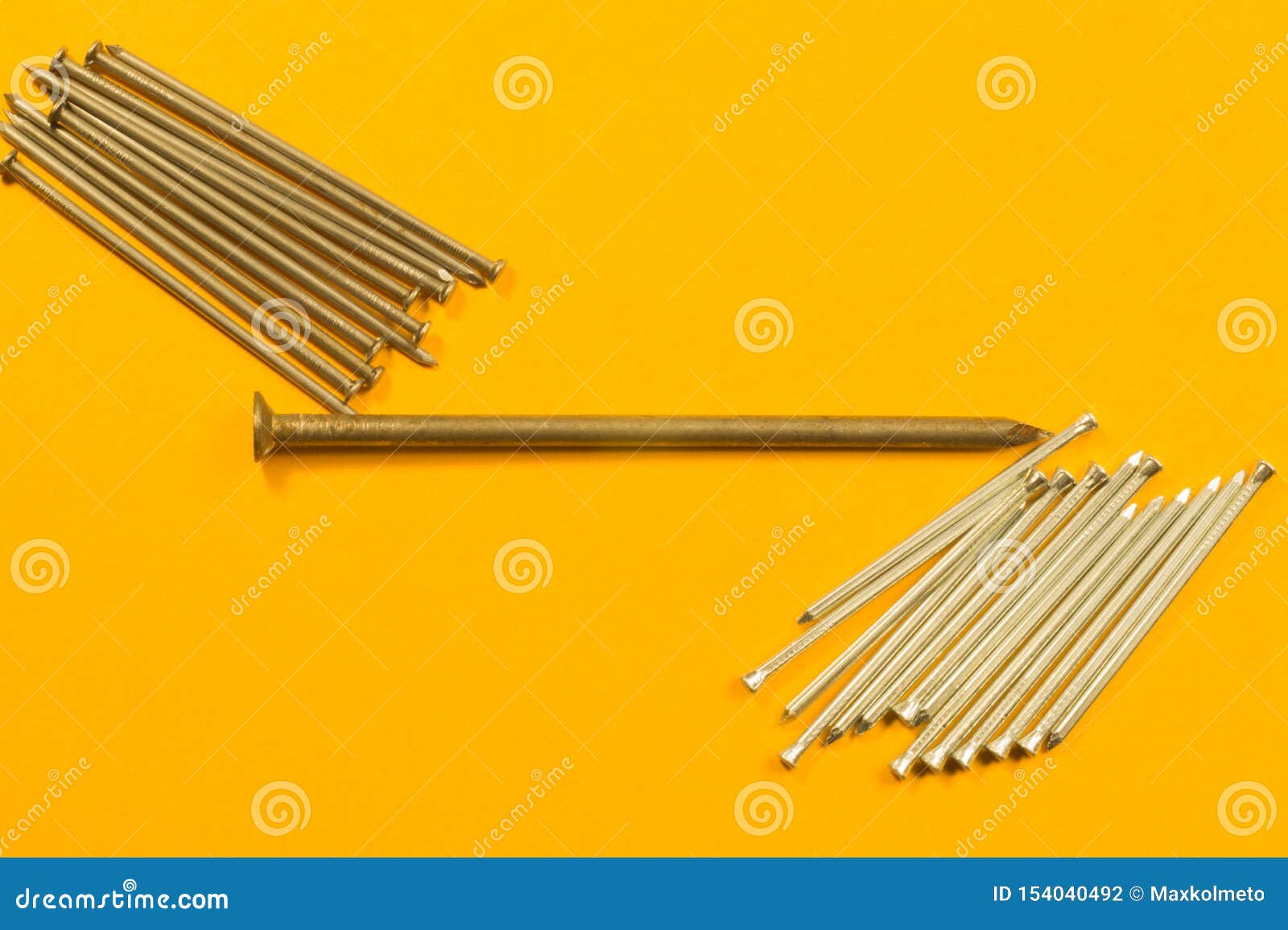 Metal Nails Isolated on Yellow Background. Working Tools Stock Photo ...