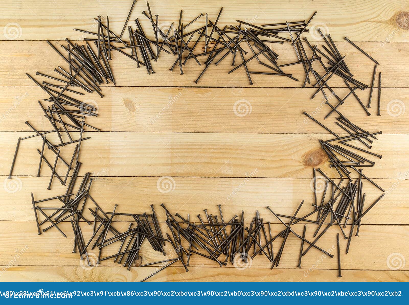 Metal Nails are Scattered on the Wooden Surface.fasteners on a Wooden ...