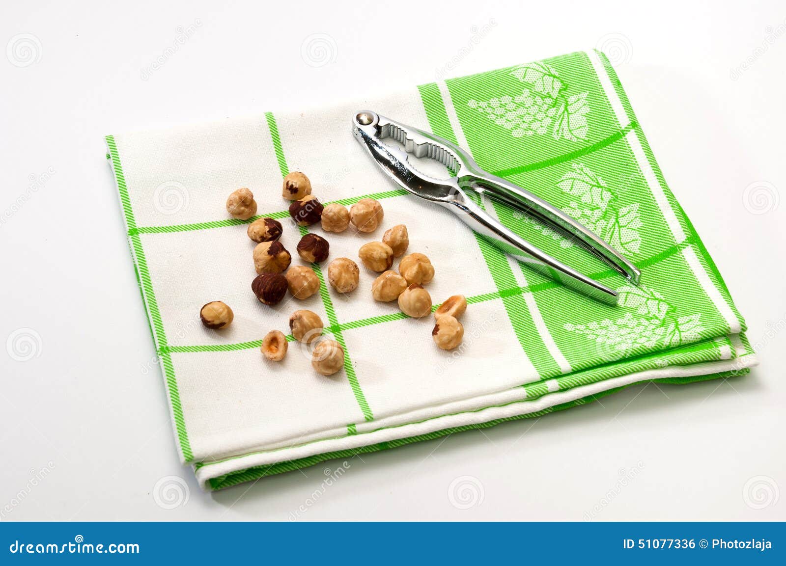 Metal Nutcracker on a Green Rag with Nuts Stock Photo - Image of ...