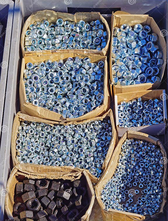 Metal nuts in boxes stock image. Image of bolts, equipment - 354020101
