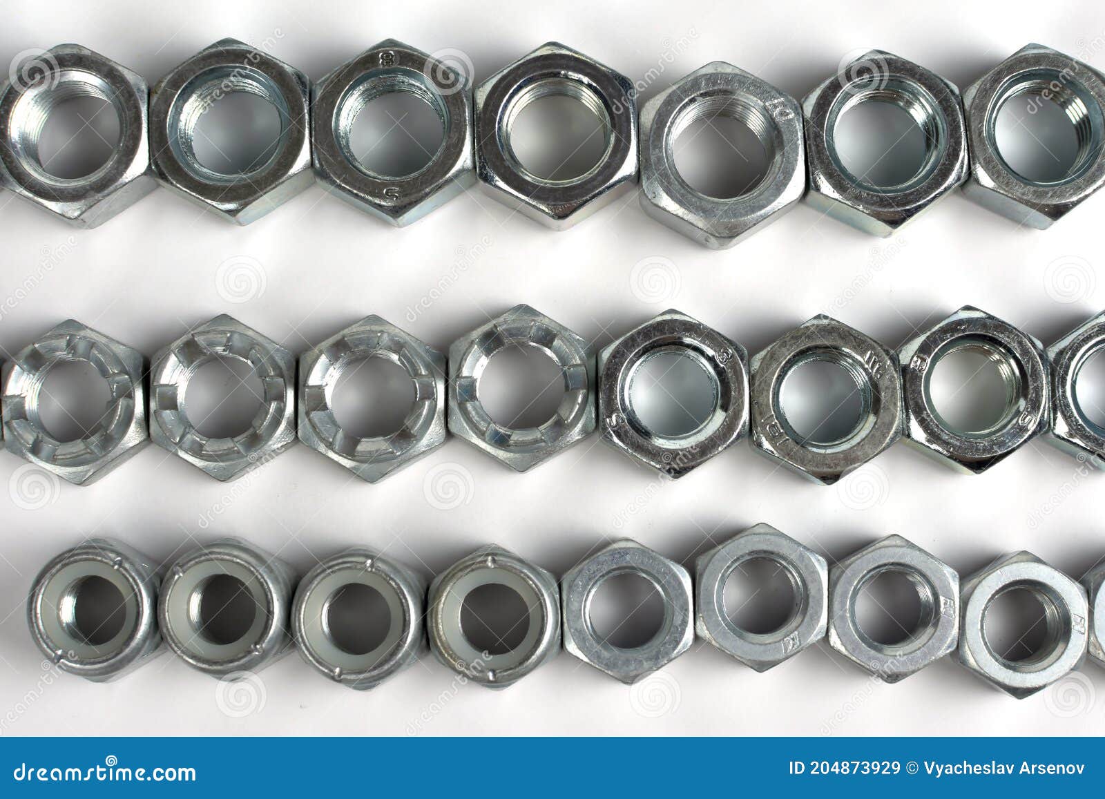 Metal Nuts of Different Sizes in Several Lines Stock Image - Image of ...