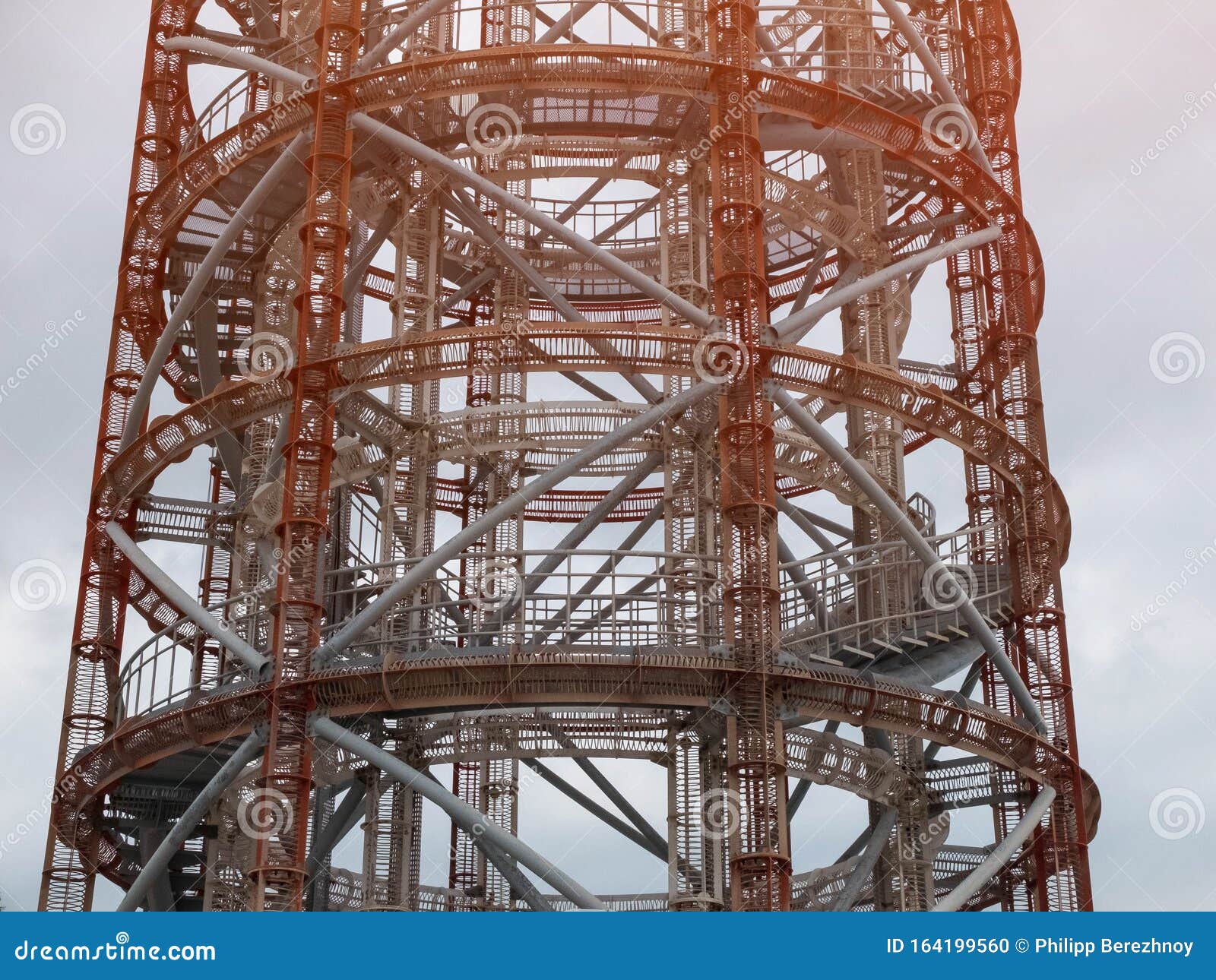 Openwork Mast Construction Of The Power Line With A Tree In The ...