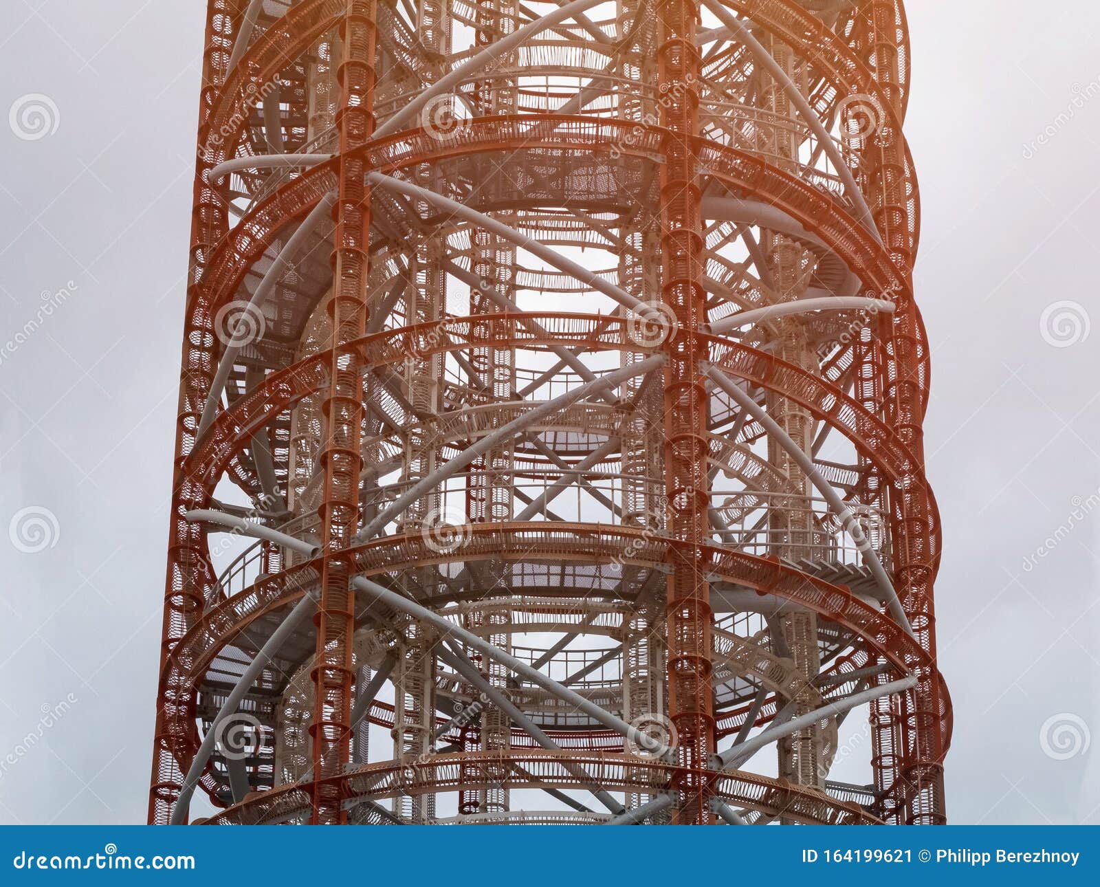 Openwork Mast Construction Of The Power Line With A Tree In The ...