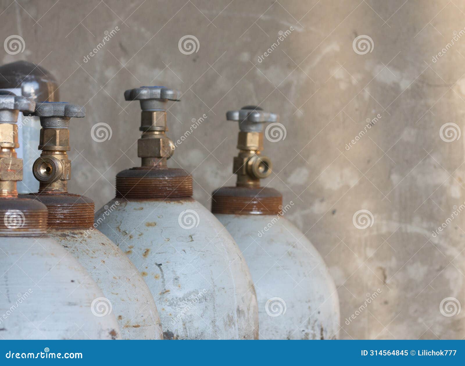 Metal Oxygen Cylinders on a Wall Background. Stock Image - Image of ...