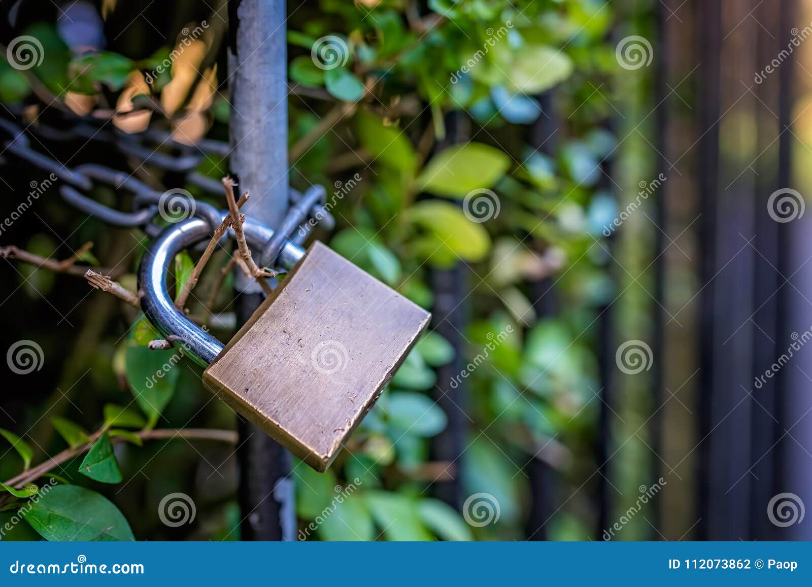 Metal padlock on the fence stock photo. Image of home - 112073862