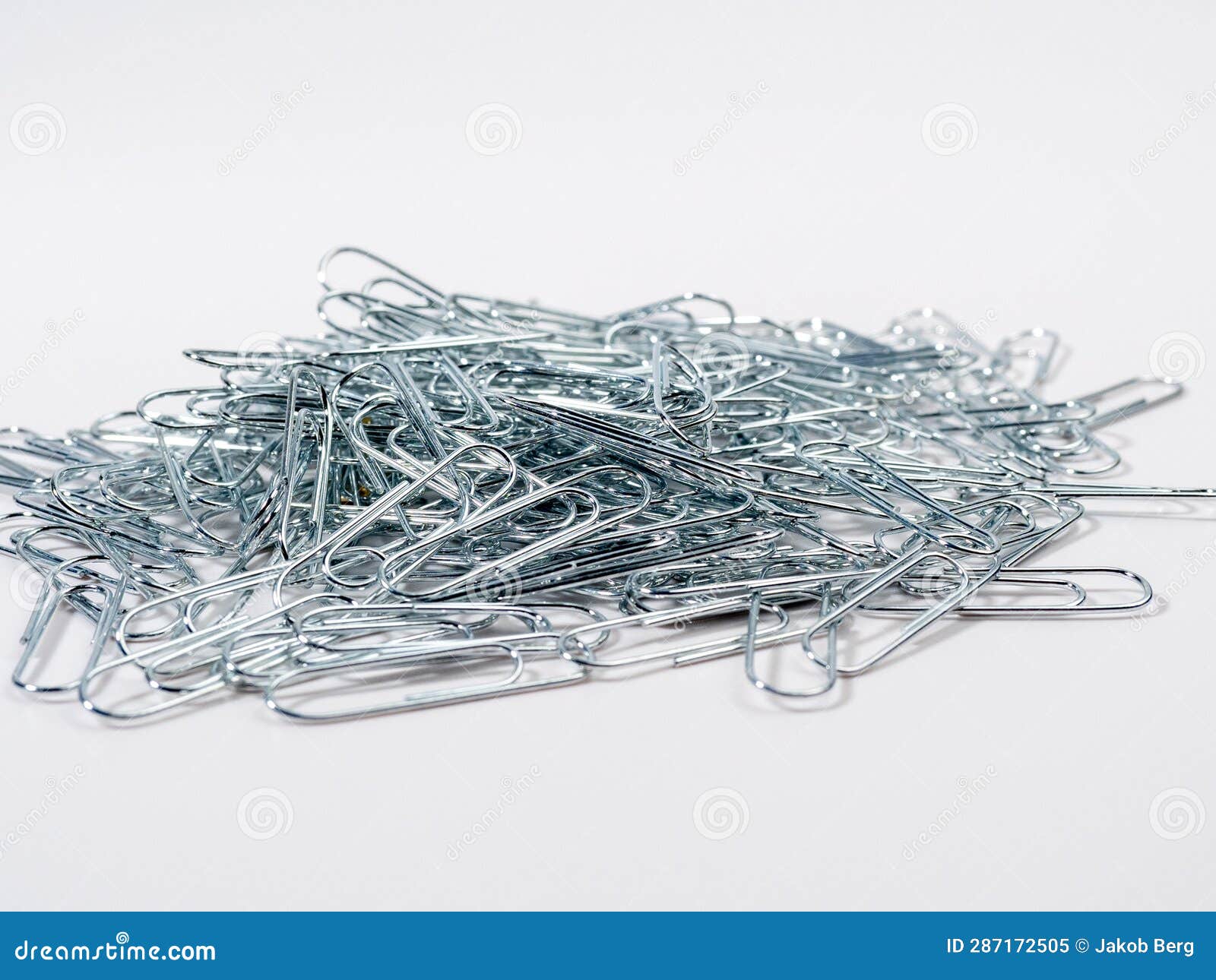 Metal Paper Clips on a White Background. Stock Image - Image of supply ...