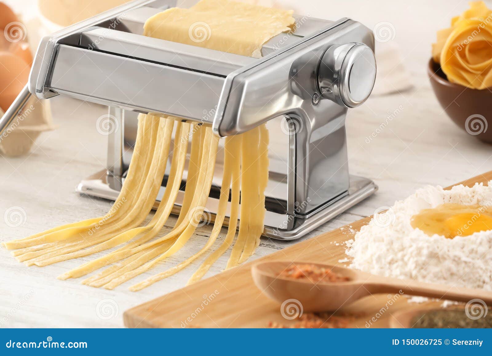 Metal Pasta Maker with Dough on Kitchen Table Stock Image - Image of ...