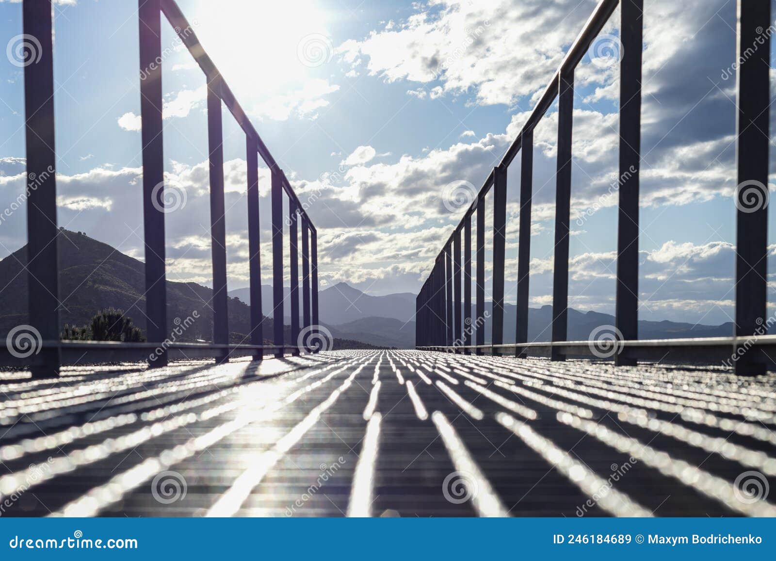 A Metal Path with Handrails Looking into the Distant Mountains on a ...