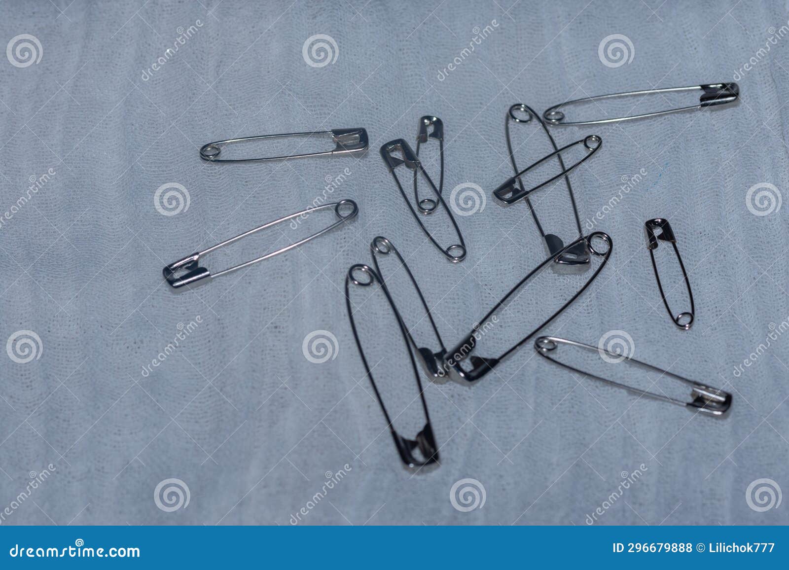 Metal Pins of Different Sizes on a White Background. Stock Photo ...
