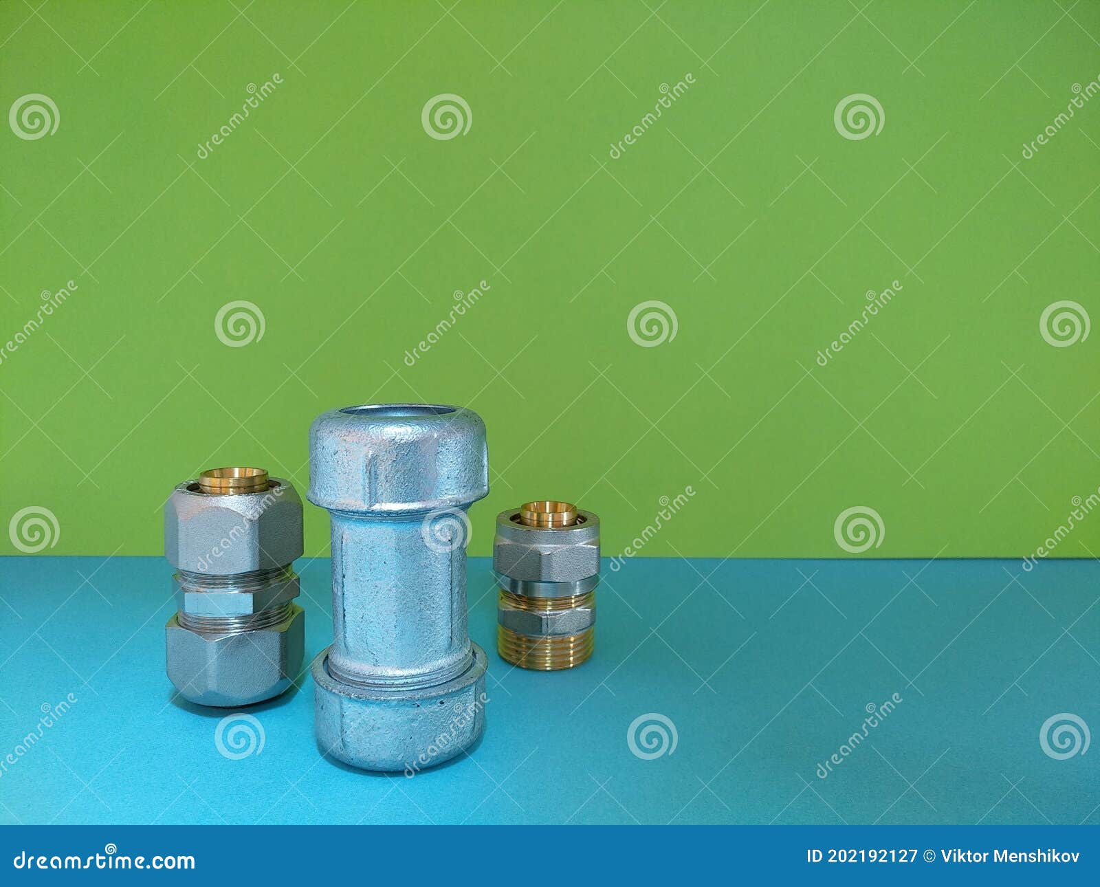 Metal Pipe Fittings on Blue Green Background Stock Image - Image of ...