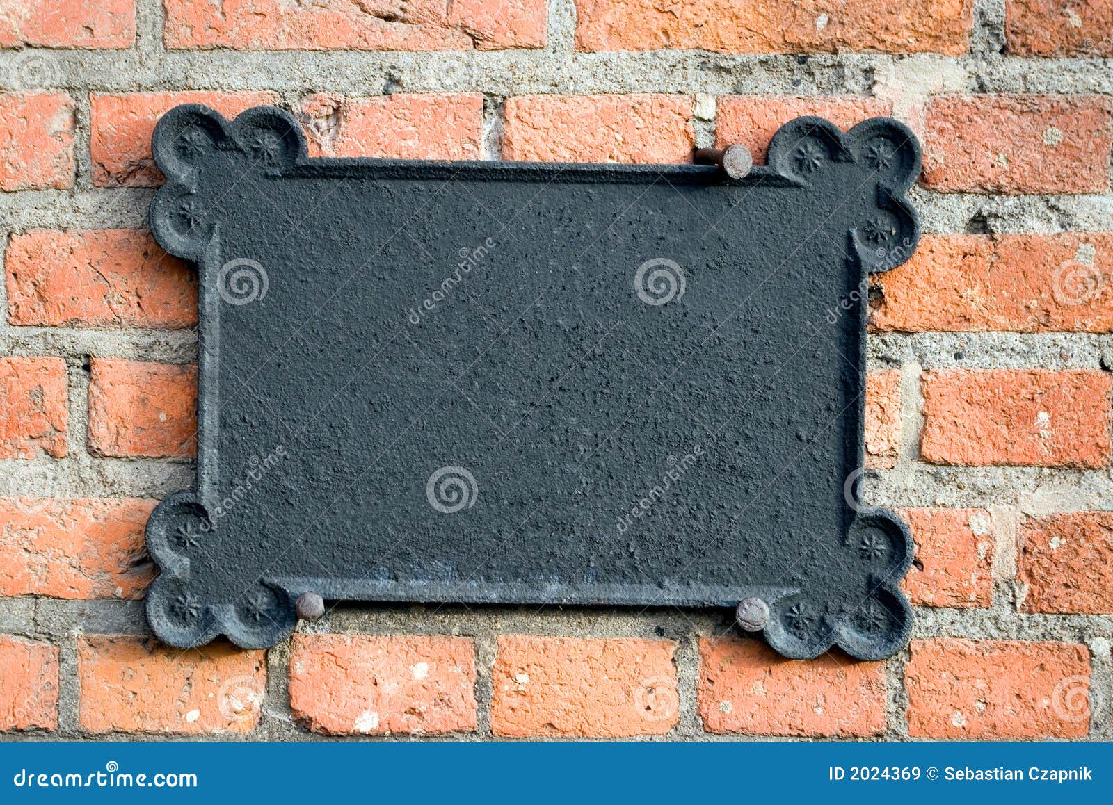 Metal plate on brick wall stock image. Image of space - 2024369