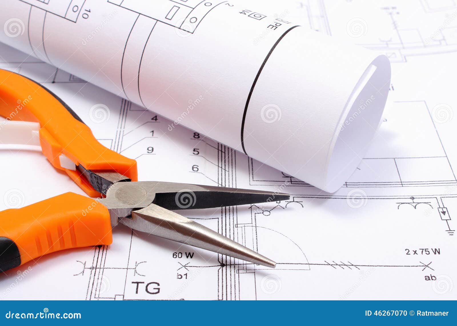 Metal Pliers and Rolled Electrical Diagram on Construction Drawing of ...