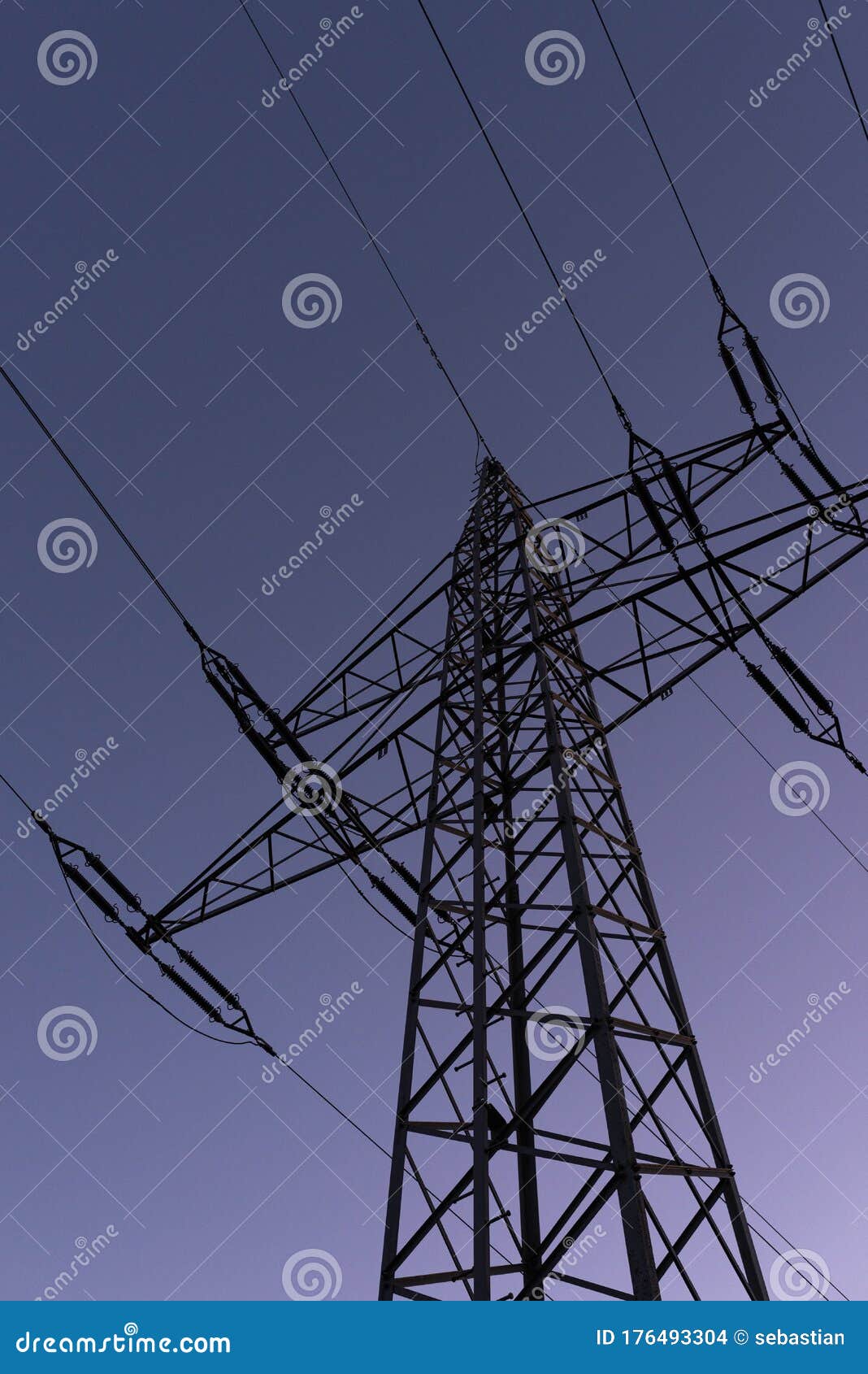 Metal power pylon at dusk stock photo. Image of angle - 176493304
